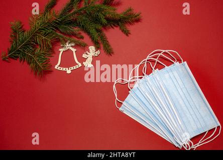 Closeup of a Christmas composition of medical masks and Christmas tree ...