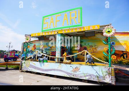 Safari animal carousel attraction at a fair by the seaside Stock Photo ...