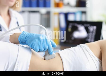 Professional medical worker examine clients body with ultrasound tool ...