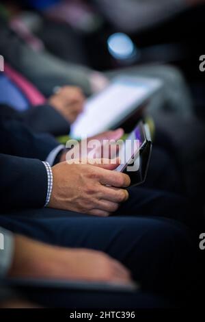 People using tablet device during travel vacation inside camper van ...