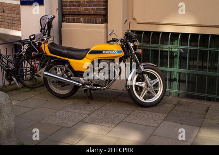 Nice motorbike parked at the side of the road Stock Photo - Alamy