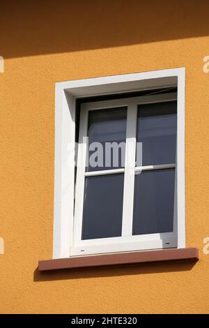 New plastic muntin windows on a residential building with clinker brick ...