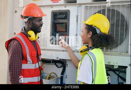 Foreman control Industrial Container Cargo freight ship at industry ...