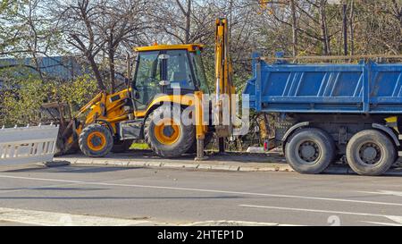Backhoe Loader Digger at Road Works Construction Stock Photo - Alamy
