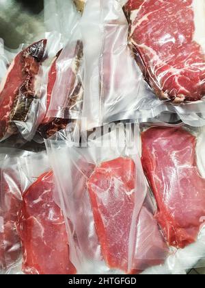 Packaged raw beef black angus tri tip steak closeup with black ...