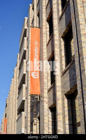 Berlin, Germany, Delivery company Lieferando building with tall banner ...