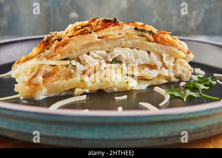 Fish gratin with potatoes and apples. Gourmet French food Stock Photo ...