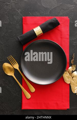 Elegant table setting on dark background Stock Photo - Alamy