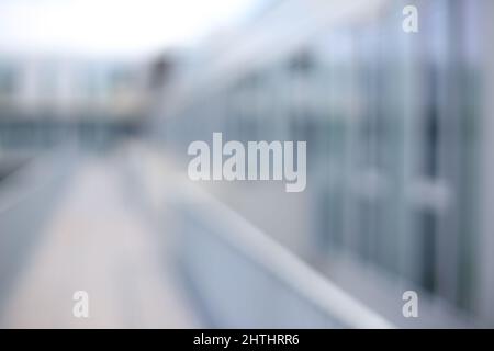 Blurred background of modern office exterior with sunlight beaming ...