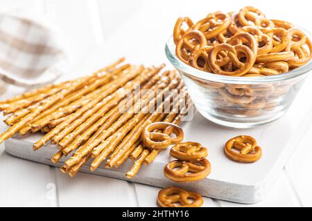 Mini pretzels and salted sticks. Crusty salted snack on kitchen table ...