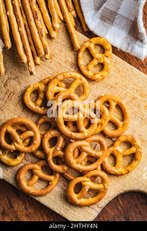 Mini pretzels and salted sticks. Crusty salted snack on kitchen table ...