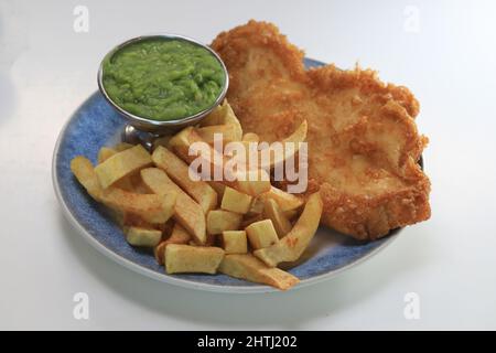 Freshly fried golden chips, at Compo's fish and chip restaurant and ...
