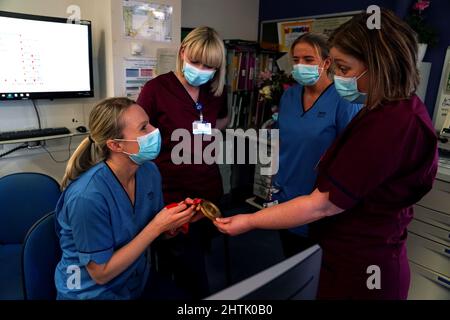 Olympic gold medal winning curler Vicky Wright shows off her medal to ...
