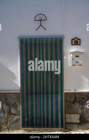 Metal Indalo Man Symbol on a wooden fence. The Indalo is an ancient ...