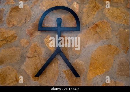 Metal Indalo Man Symbol on a wooden fence. The Indalo is an ancient ...