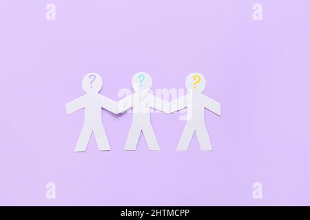 Paper with question marks on lilac background Stock Photo - Alamy