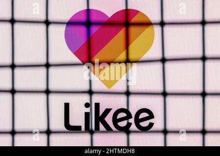 Smartphone with Likee short video sharing service logo on screen in ...