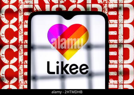 Smartphone with Likee short video sharing service logo on screen in ...