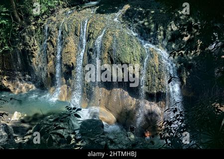 Enjoying the hot spring waterfall of Finca Paraiso, Rio Dulce ...