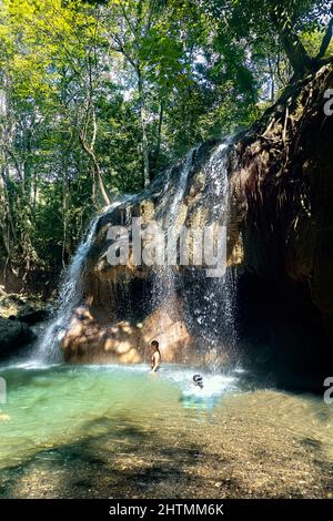 Enjoying the hot spring waterfall of Finca Paraiso, Rio Dulce ...