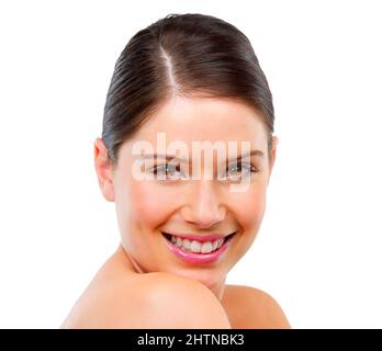Soft skin makes me happy. Studio shot of a beautiful young woman ...