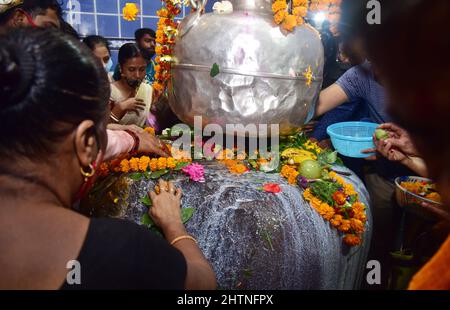 Guwahati, Guwahati, India. 1st Mar, 2022. Hindu devotees queue to offer ...
