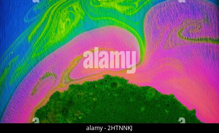 Mixing acidic paints. Stock footage. Bright acidic inks of different ...