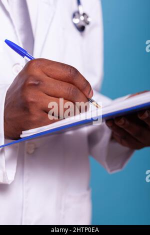 stethoscope clipboard ballpoint pen on vintage wooden board wery close ...