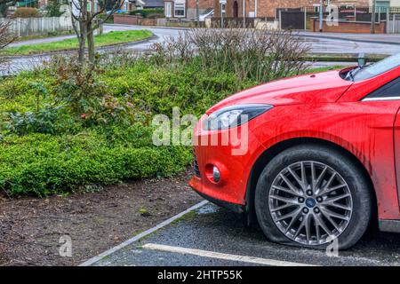 Parked car with front flat tyre on drivers side Stock Photo - Alamy