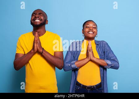 Grateful woman having HOPE praying to God. Spiritual girl smiling to ...