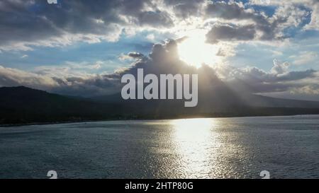 View over a bay to volcano Gunung Agung, Amed, Bali, Indonesia Stock ...
