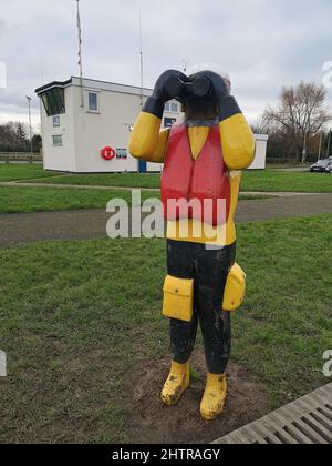 Wooden RNLI carved statue looking through binoculars at Flintshire ...