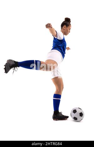 Side view of biracial female athlete bending at starting position by ...