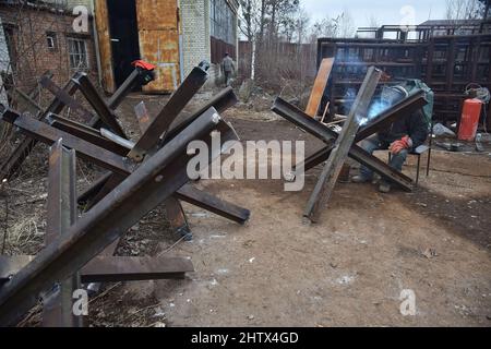 A Ukrainian volunteer seen producing anti-tank hedgehogs in Lviv. The ...