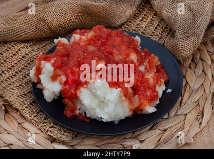 Traditional South African Pap and sous, maize meal covered in tomato ...