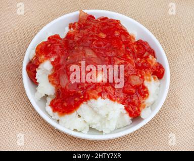 Traditional South African Pap and sous, maize meal covered in tomato ...