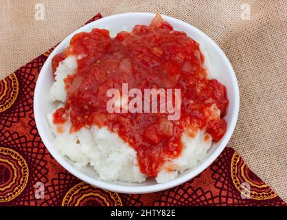 Traditional South African Pap and sous, maize meal covered in tomato ...
