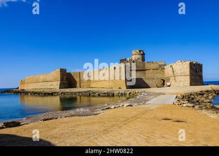 Beautiful shot of a castle and the sea form the beach Stock Photo - Alamy
