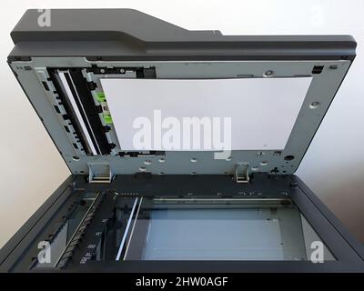Photocopier with open lid, glass area surface visible. Small home use ...