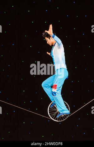 Chinese Male Acrobat Balancing on a Tightrope Stock Photo - Alamy