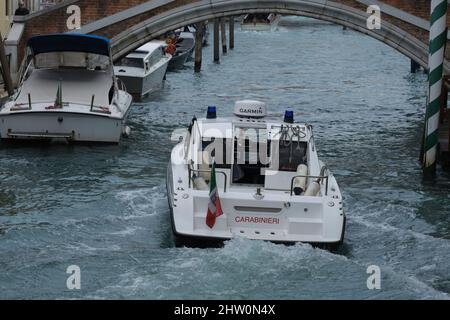 Carabinieri speedboat rushing along canal in venice Stock Photo - Alamy