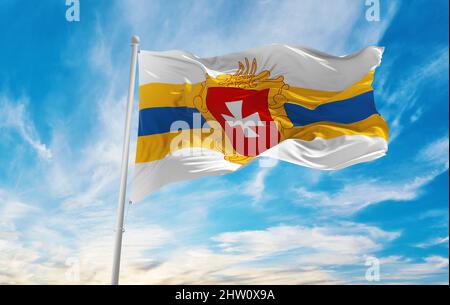 flag of Rivne region , Ukraine at cloudy sky background on sunset ...