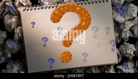 Image of question marks over notebook and paper Stock Photo - Alamy