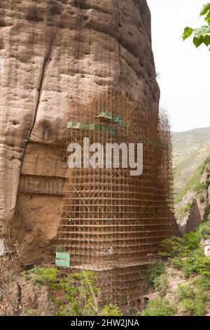 Scaffold / scaffolding on the mountainside where ancient caves were ...