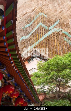 Scaffold / scaffolding on the mountain side where ancient caves were ...