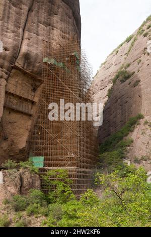 Scaffold / scaffolding on the mountain side where ancient caves were ...