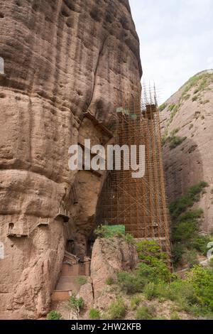 Scaffold / scaffolding on the mountain side where ancient caves were ...
