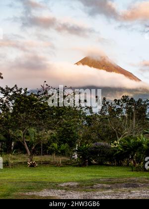 A view of the giant active volcano of Arenal seen from a distance over ...