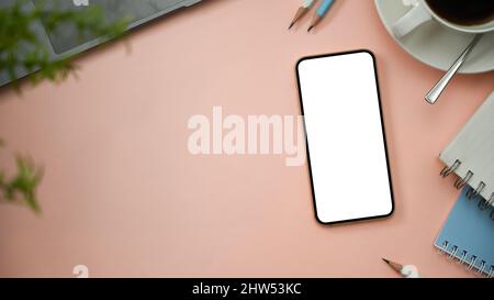 Overhead shot of pink feminine designer workspace with laptop computer ...