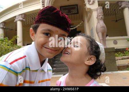 Parsi brother and sister celebrating new year in front of agyari ...